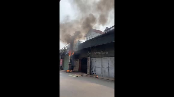 Men risk injury to extinguish blaze on exploding power pole in Vietnam ...