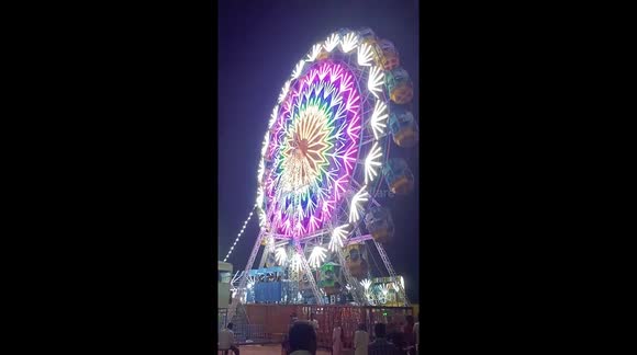 Lightning beautiful ferris wheel in village annual festival of ram ...