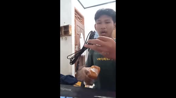 Oops! Guy in shock after accidentally snipping cable during unboxing ...