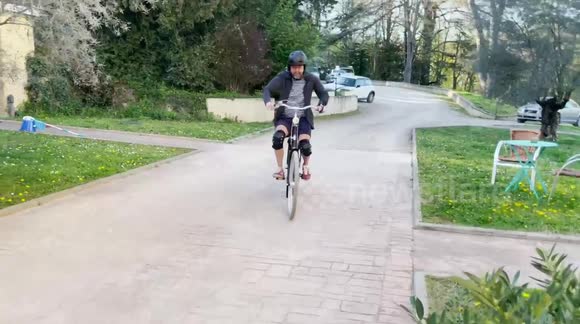Man who received world's first double arm transplant rides bike for the ...