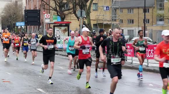 A Runners' Group Seen On Course Cheered On By Supporters At The London ...