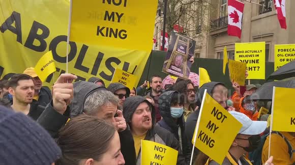 Anti-monarchy protesters chant “Not my king” and “You can stick your ... Anti-monarchy protesters chant “Not my king” and “You can stick your ...
