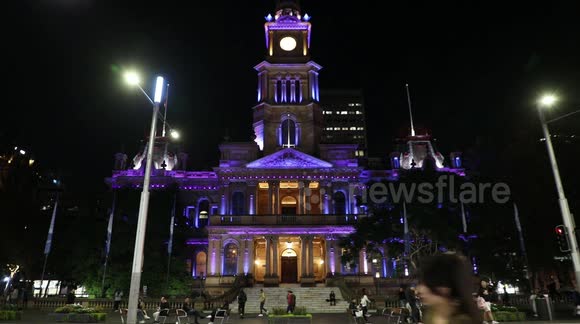 Sydney Town Hall is lit up in purple, believed to be fro the coronation ...