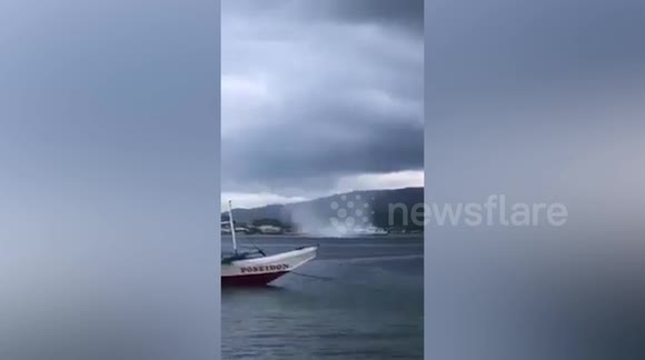 Terrifying waterspout whirls close to fishing boats in the Philippines ...