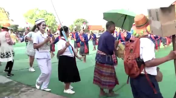 Locals parade stuffed toy cat inside cage for bizarre rain-making ...