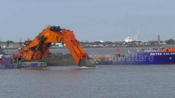 Monster backhoe dredger Goliath digging spoil from the seabed at ...