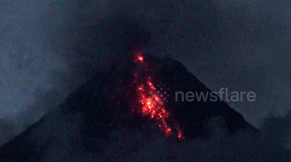 Lava flows out of Mayon Volcano's crater as slow eruption continues ...