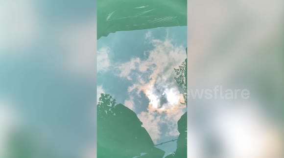 Clever eclipse-watcher observes phenomenon through sun's reflection in ...