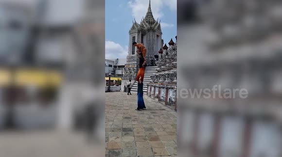 Chinese tourists show off human pyramid acrobat moves outside Thai ...