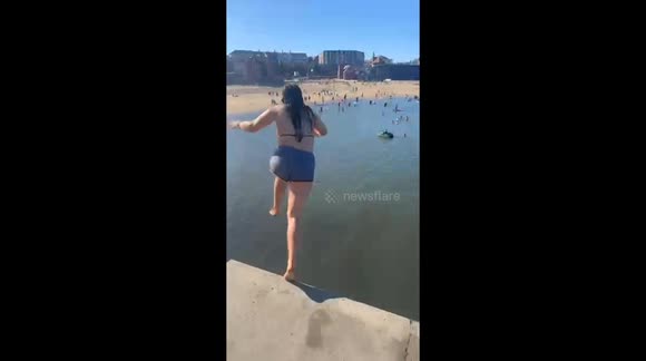 Woman shares stark warning after snapping leg in shallow water at beach ...