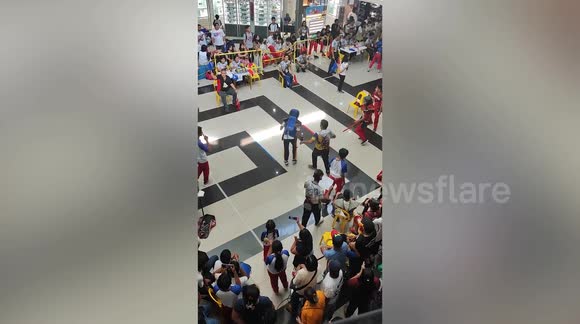Unusual sword-fighting contest in middle of shopping mall in the ...