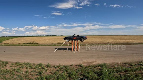 Gravity-defying stunt: Car collision masterfully lands vehicle on its ...