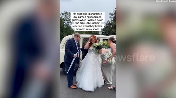 Blind bride lets guests "walk in her shoes" by blindfolding them as she ...