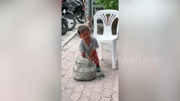 Overdramatic boy cries with arm stuck in concrete and pokes it back ...