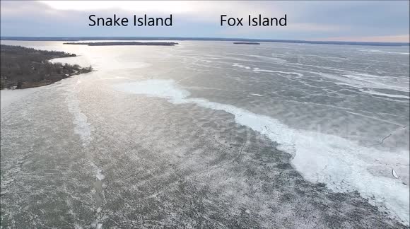 Dramatic Drone Footage of Snake and Fox Islands Within Semi-frozen Lake ...