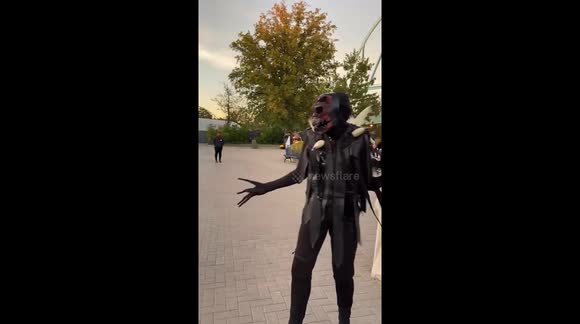Happy Halloween! Actors dressed up as scary monsters roam around ...