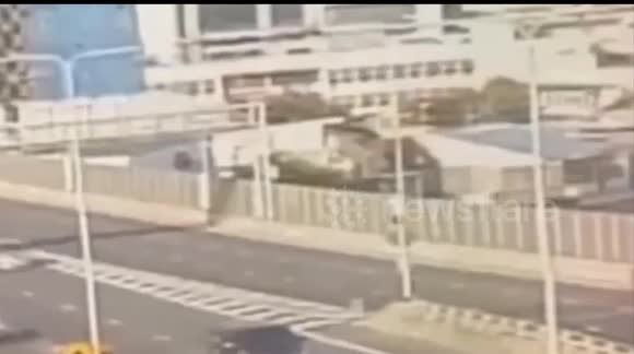 Car dangles in space between two bridges parallel to each other ...