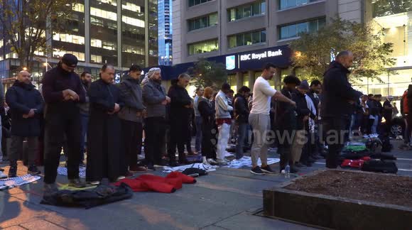 Hundreds pray in the streets of downtown Toronto for those dead and ...