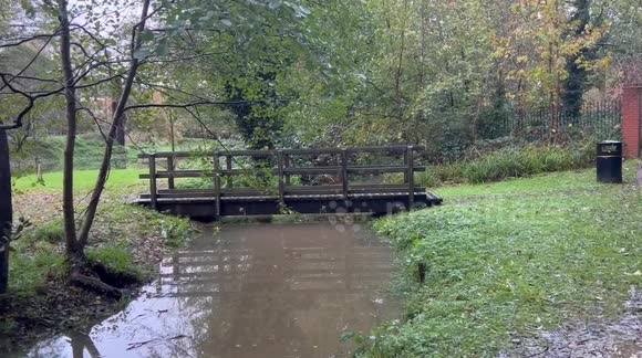 A bridge to Tanbridge House School is blocked by flood water next to ...