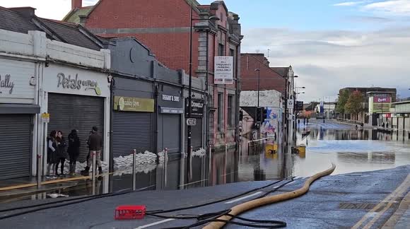 Fire service pump water from flooded premises in Downpatrick Town, UK ...