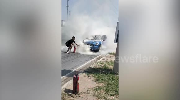 Men help each other extinguish fire on MINI Cooper car - Buy, Sell or ...