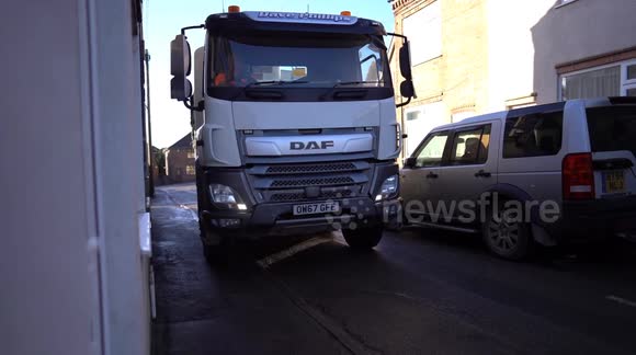 "Our homes are covered in mud by builders driving lorries 8ins past our ...