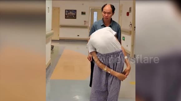 Woman with 180-degree spine fold can stand straight again after life ...