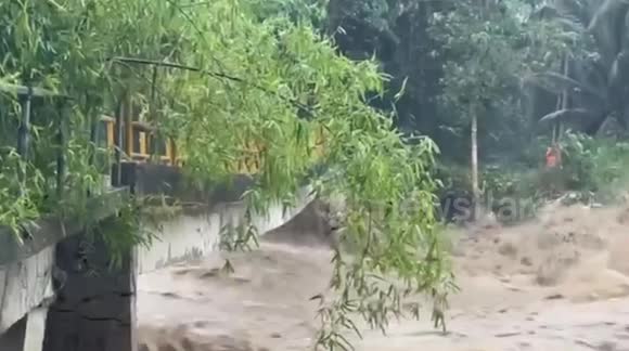 Pedestrian bridge collapses in raging floods in the Philippines - Buy ...