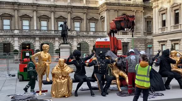 Workers install stunning new artwork ‘The First Supper’ at London’s ...