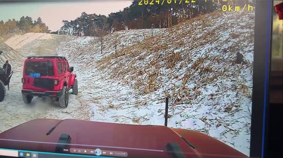 Daredevil driver rolls down snowy hill, narrowly avoids friends and ...