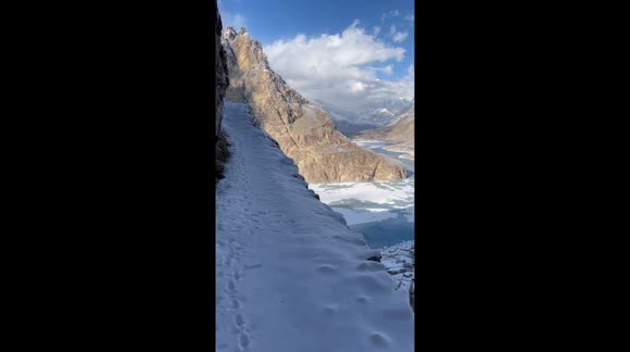 Jaw dropping cliff side path way in the snow at attabad lake in Hunza ...