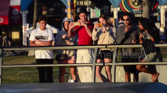 Jude Law with girlfriend Phillipa Coan and his kids watch skateboarders ...