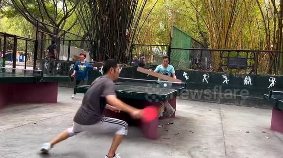 Chinese man triumphs using plank as makeshift table tennis bat against ...