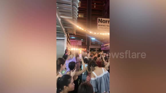 Armed cops overpowered in mass brawl between Filipino and Thai ...