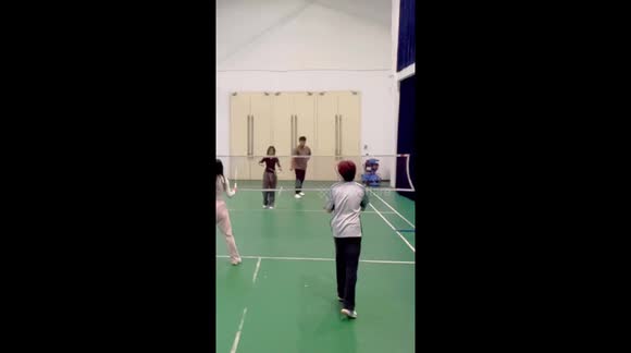 Friends have amusing badminton fail when one is whacked in the face ...
