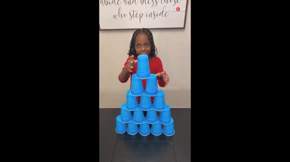 Kids successfully rearrange a cup pyramid into a tall cup tower - Buy ...