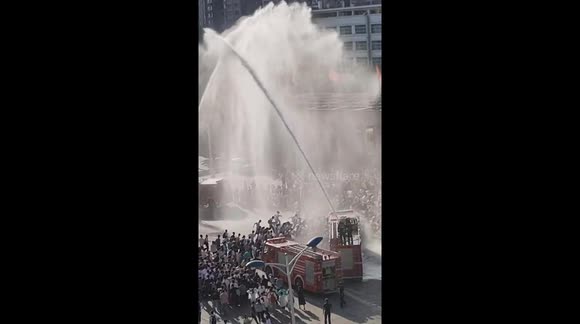 Fire department creates "Dragon Gate" water arch to celebrate students ...