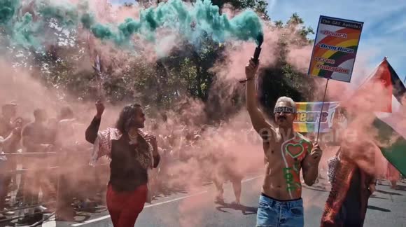 Pro-Palestine marchers set off smoke flares and chant for ceasefire ...