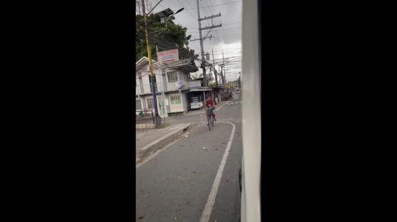 Cyclist rides with python wrapped around his shoulders - Buy, Sell or ...