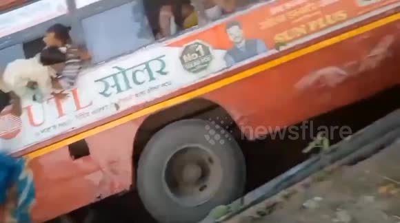 Passengers rescued from bus hanging off bridge in northern India - Buy ...