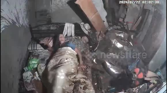 Elderly Chinese man narrowly escapes falling water tank during typhoon ...