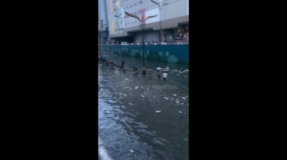 Filipinos show resilience during typhoon Carina in flood-filled ...