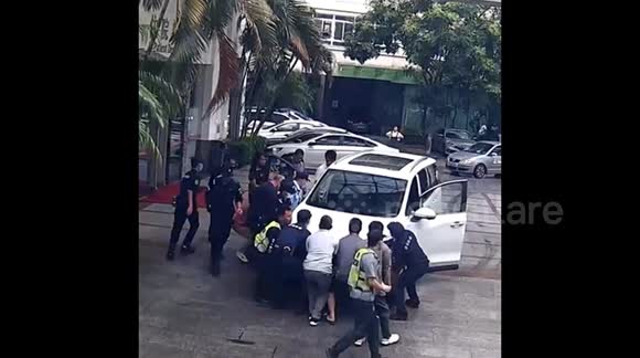 Alert bystanders and police lift car to rescue child trapped underneath ...