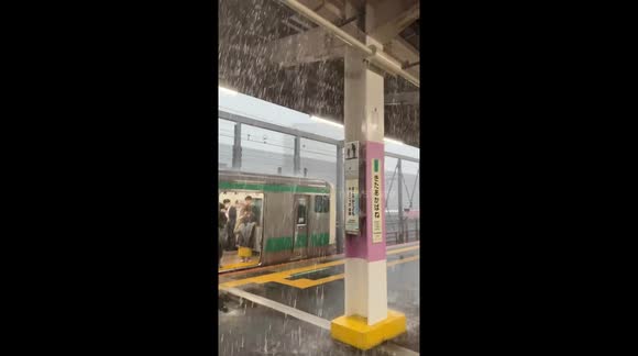 Rainwater drips through ceiling of train station during heavy downpour ...
