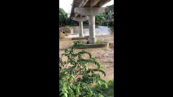Teenager stuck under bridge when river surges rescued by locals - Buy ...
