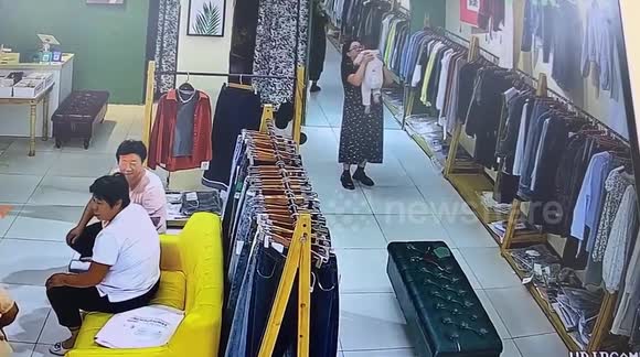 Mother falls on child after tripping over stool in clothes store - Buy ...