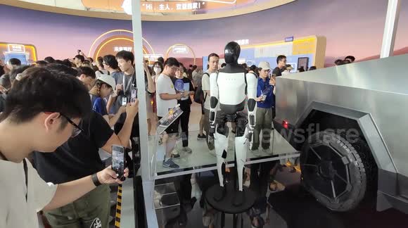 China: Tesla's Latest Optimus Prime Humanoid Robot and a Cybertruck at ...
