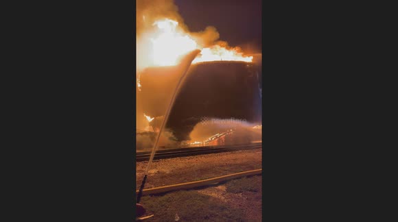Controlled burn goes awry as old coop elevator collapses onto railroad ...