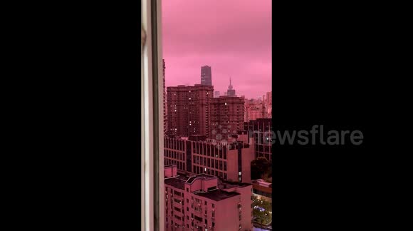 Shanghai sky turns pink and purple on eve of Typhoon Bebinca's landfall ...