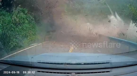 Motorist's windscreen cracked as rocks from landslide crash onto road ...
